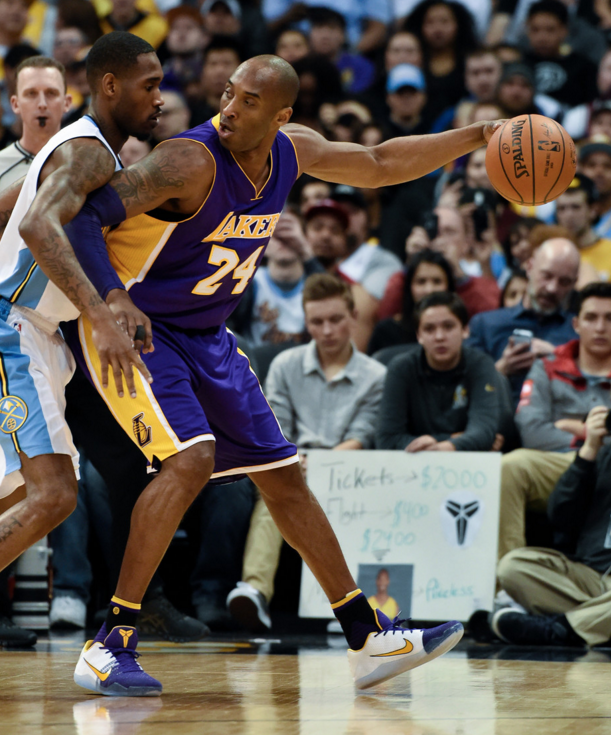 Kobe Gives a Young Fan a Signed Pair of PE's Right Off His Feet ...